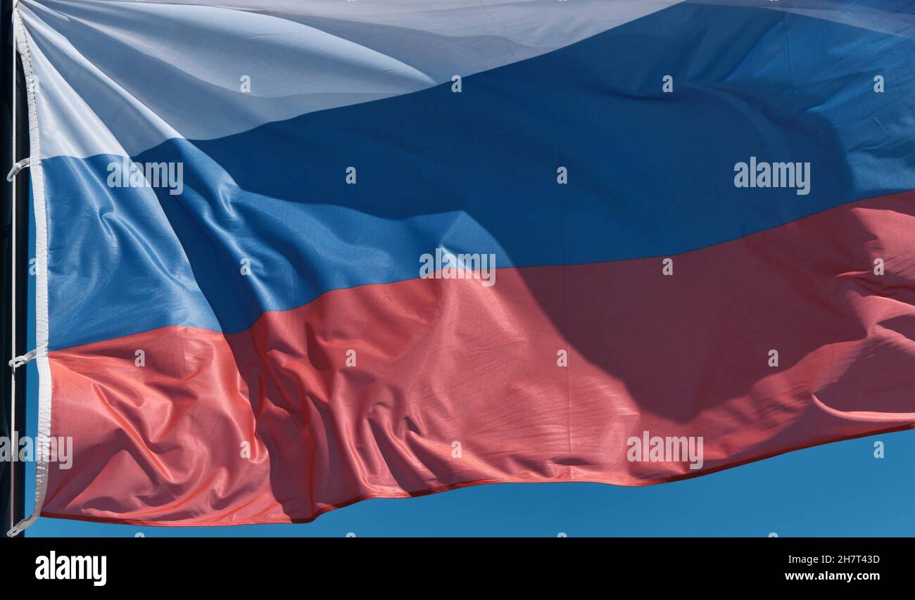 Flag of the Russian Federation flutters in the wind. Close up shot ...