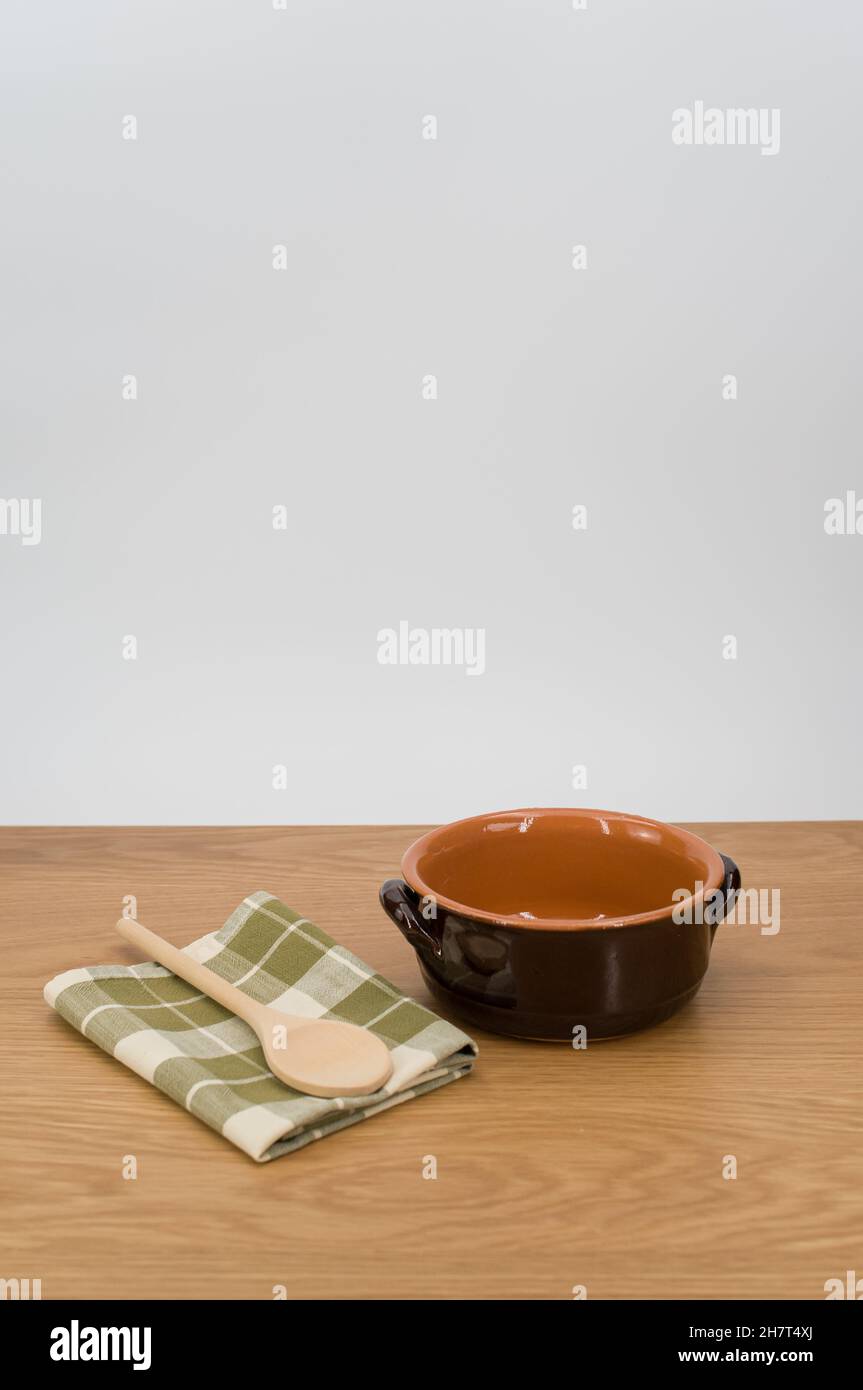 terracotta bowl and natural solid wood kitchen tools and table napkin ...