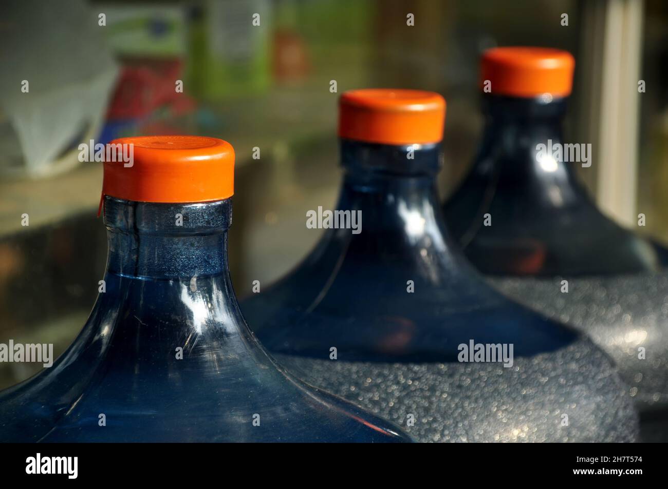 Close up of the orange colored mineral water gallon cover. The color of ...