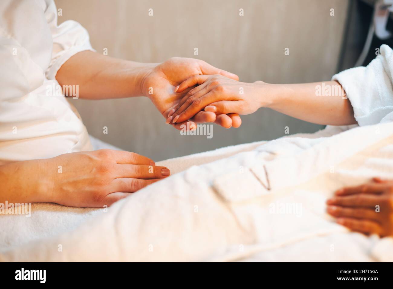 Hand massage. Physiotherapist holding the client's hand. Doctor hand ...