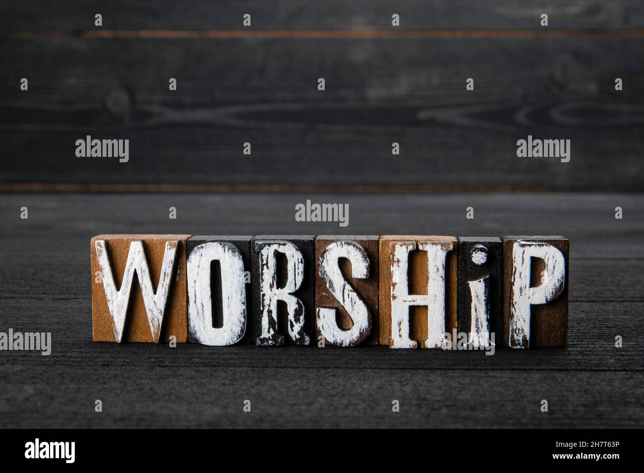 Worship. Wooden alphabet letters on a dark background Stock Photo - Alamy