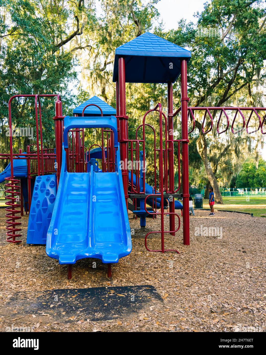 Vertical shot of a red and blue children's playground in a park Stock ...