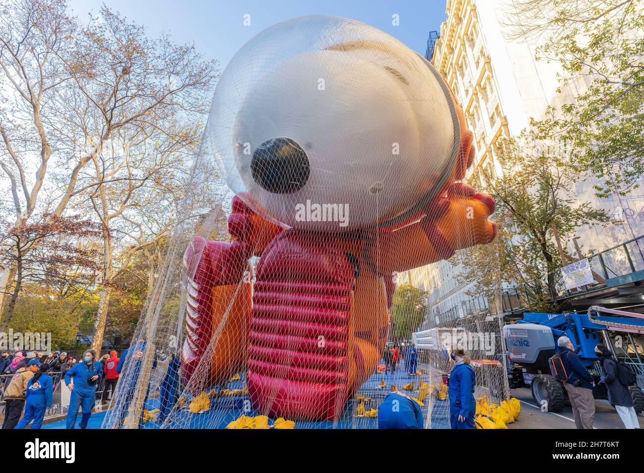 Workers work on Astronaut Snoopy balloon during 95th Macy's ...