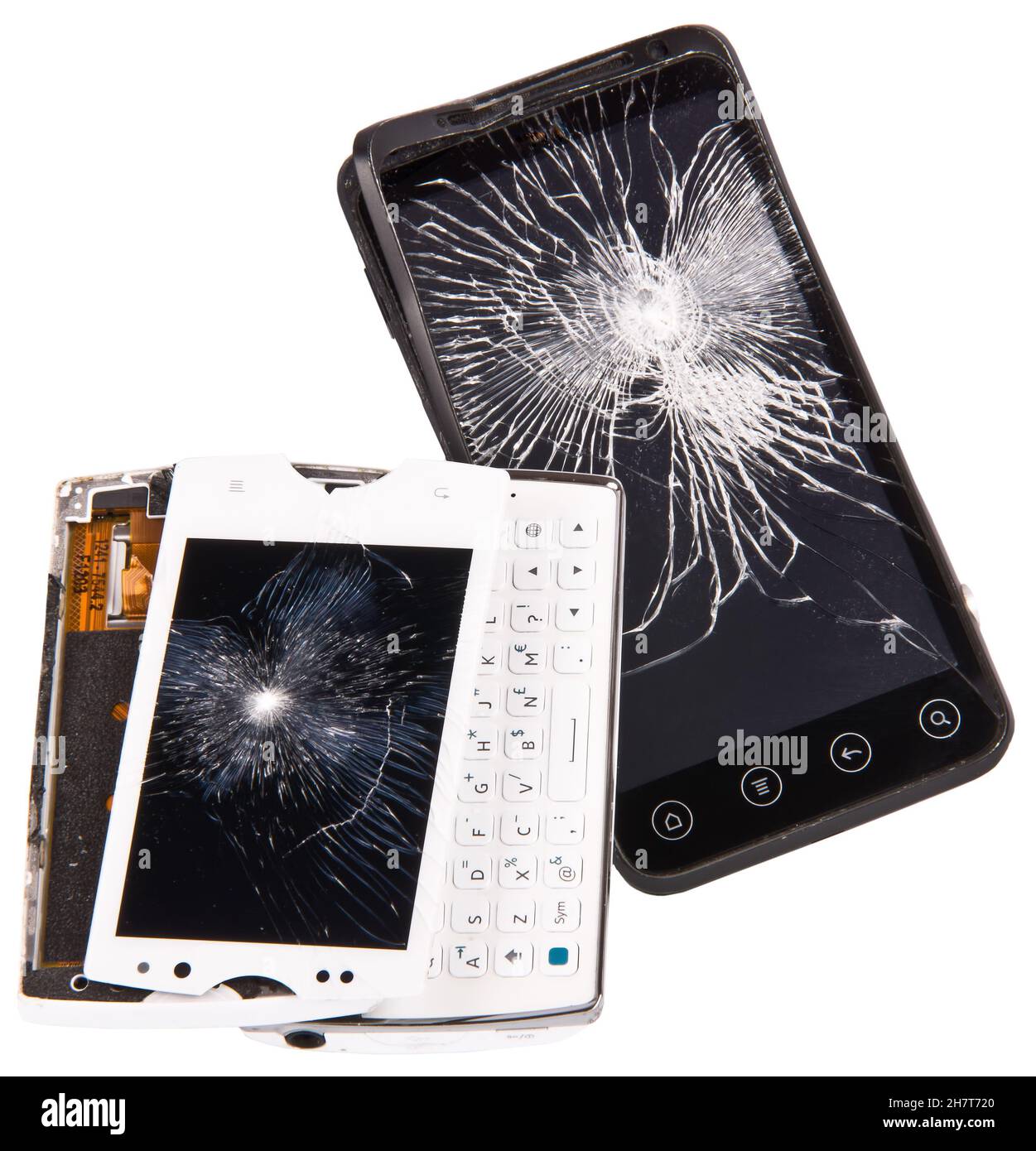 Closeup of two black and white cellphones with broken screens, top ...