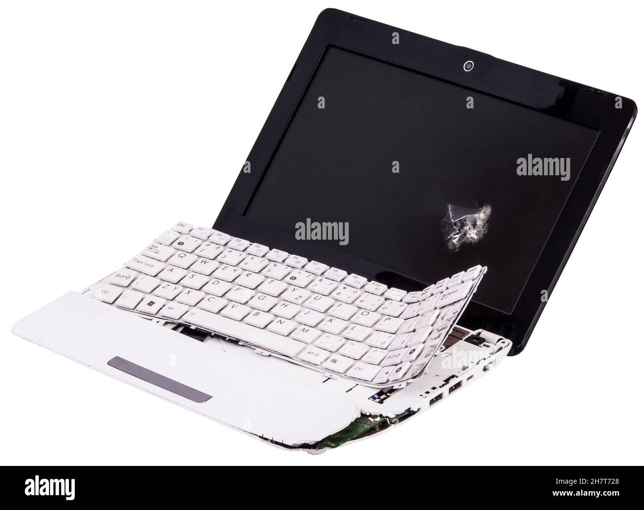 Closeup of a black and white laptop with broken screen base panel ...