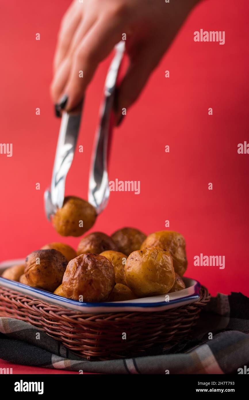 Close-up shot of sweets on the bowl isolated on the red background and ...