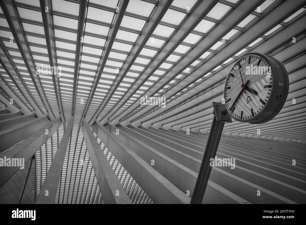 Grayscale shot of a clock near an architectural ceiling Stock Photo - Alamy