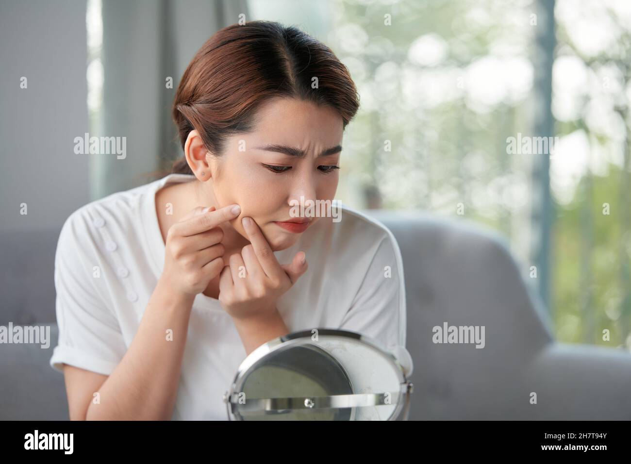 Hand squeezing face hi-res stock photography and images - Alamy