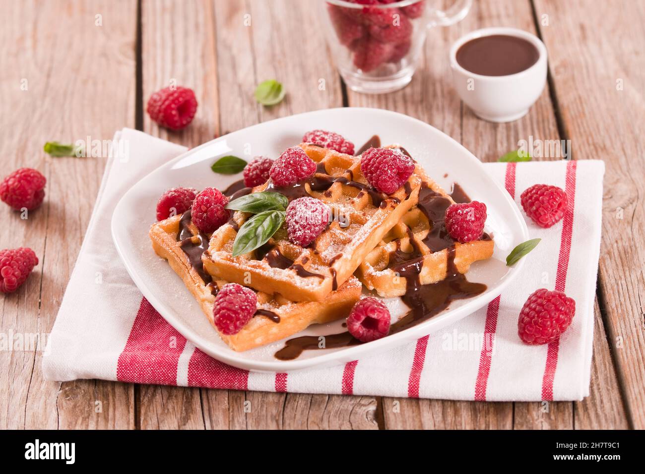 Waffles with raspberries and chocolate cream Stock Photo - Alamy