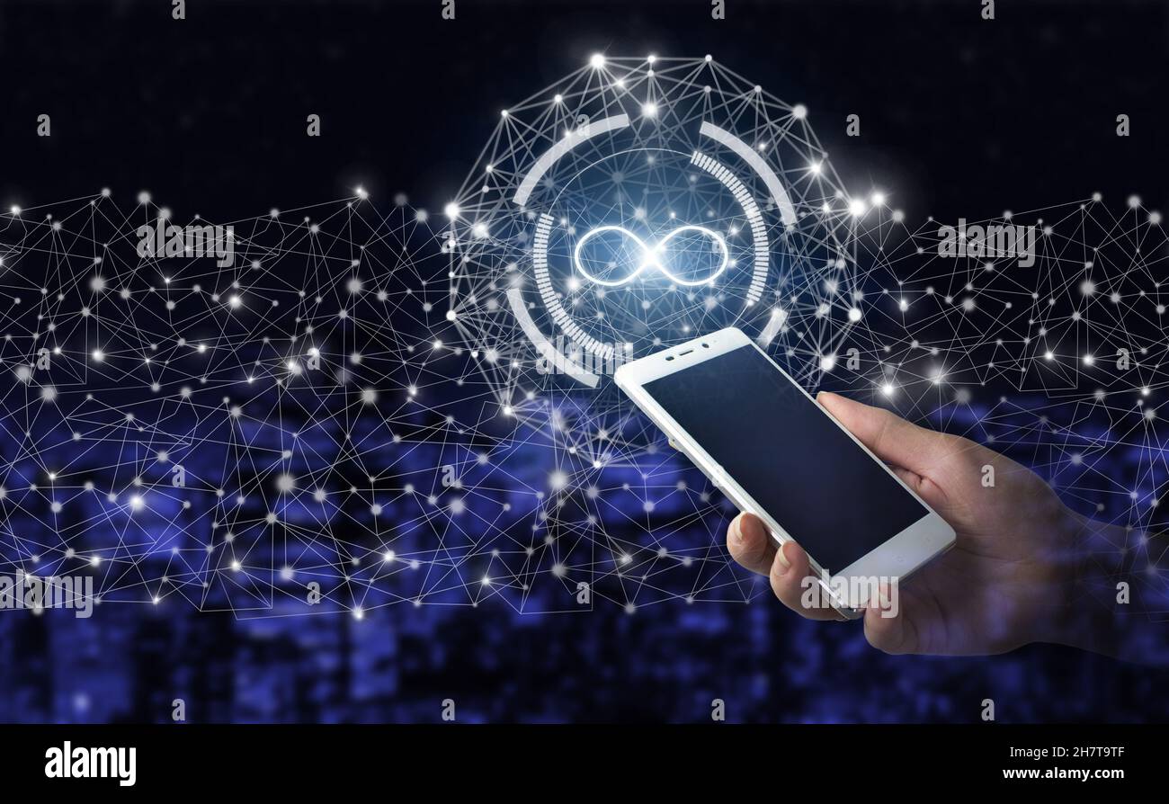 Circular economy. Infinite concept. Hand hold white smartphone with ...