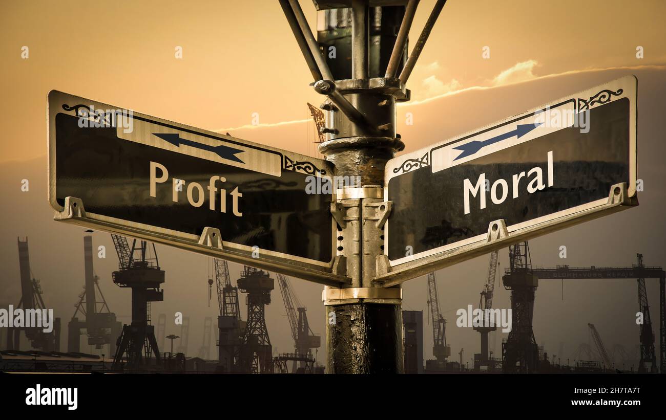 Street Sign the Direction Way to Moral versus Profit Stock Photo - Alamy