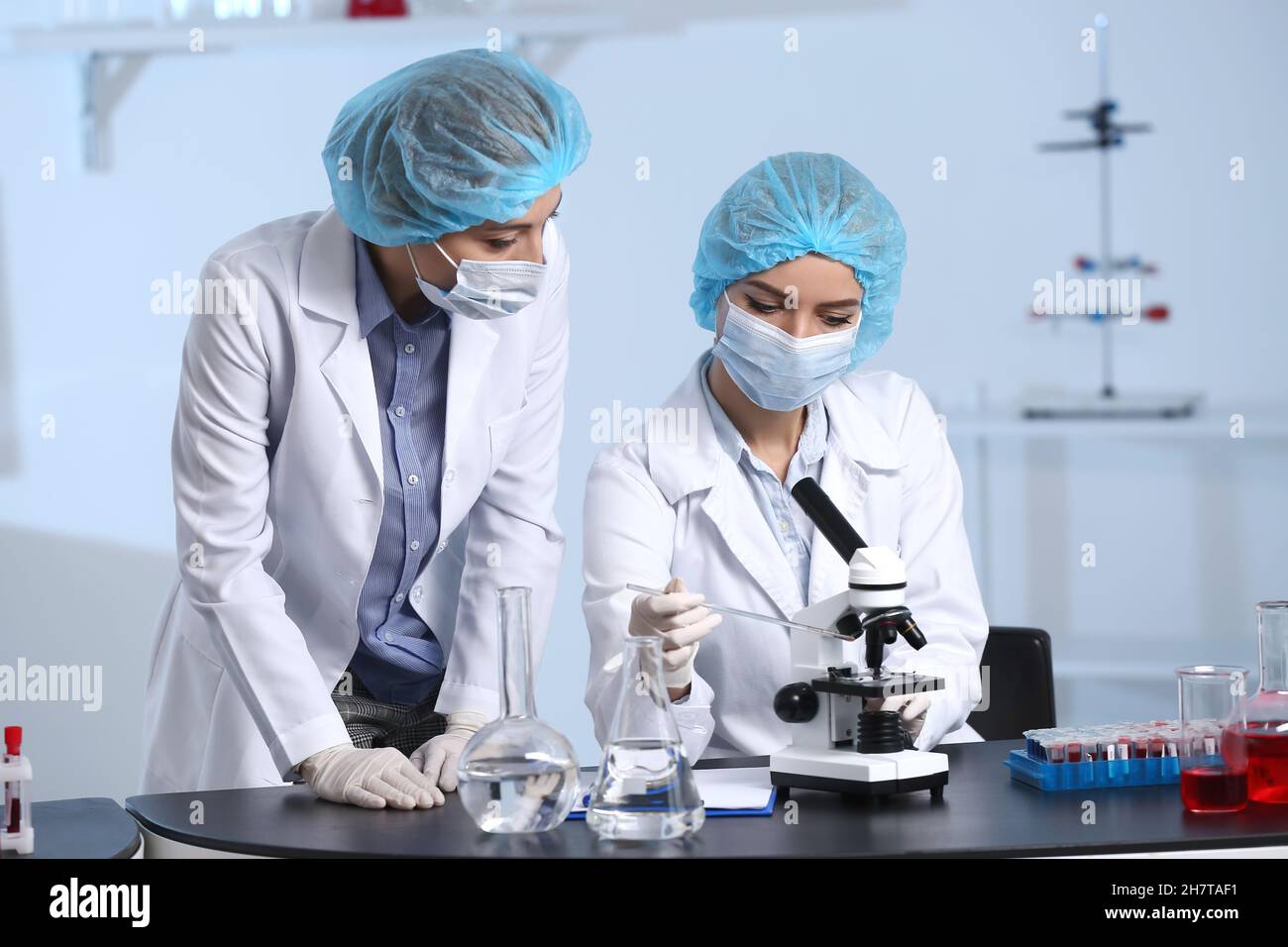 Scientists studying sample in hi-res stock photography and images - Alamy