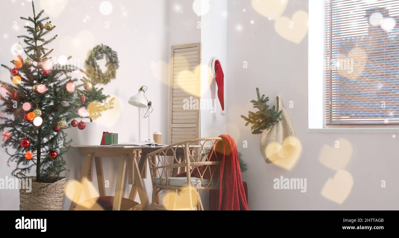 Interior of modern room with Christmas tree and comfortable workplace ...