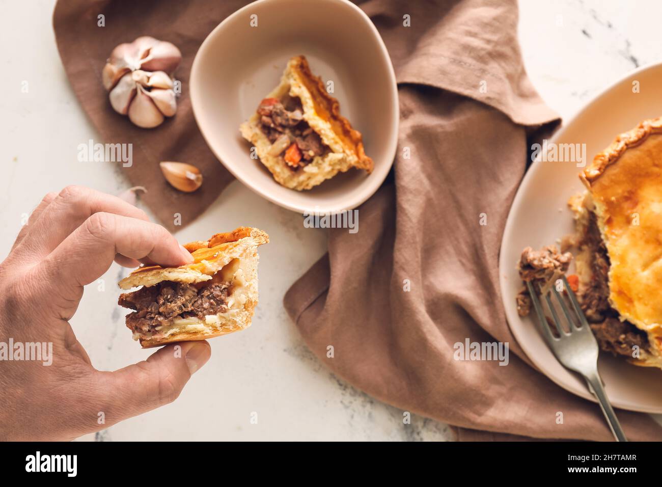 Woman eating pie meat hi-res stock photography and images - Alamy