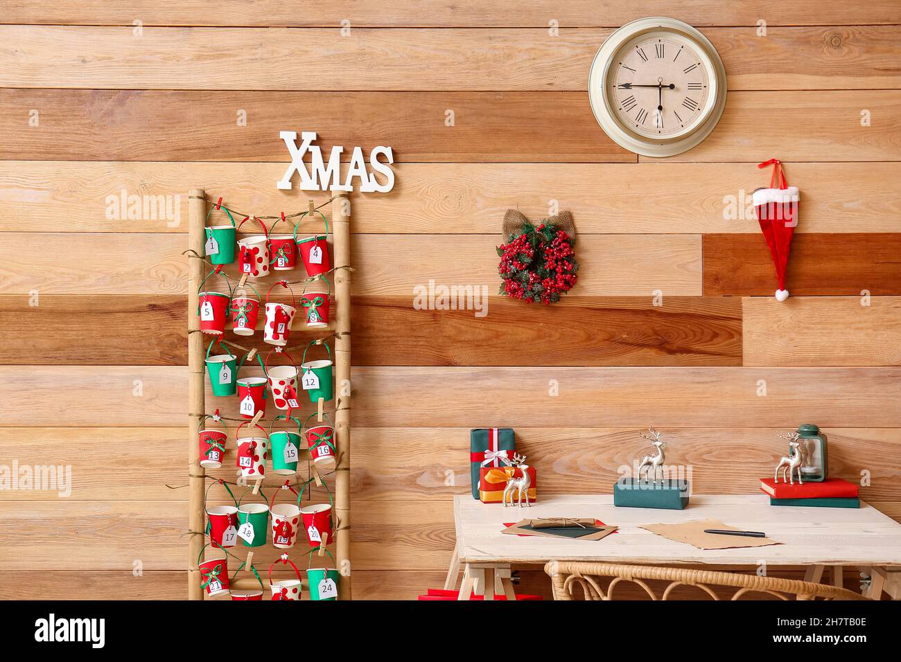 Modern workplace and advent calendar in room decorated for Christmas ...