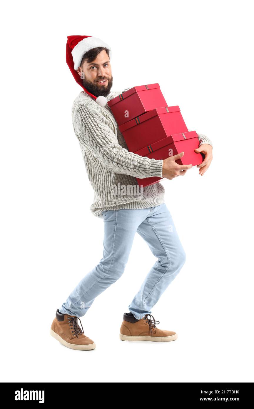 Walking man with Christmas gifts on white background Stock Photo - Alamy