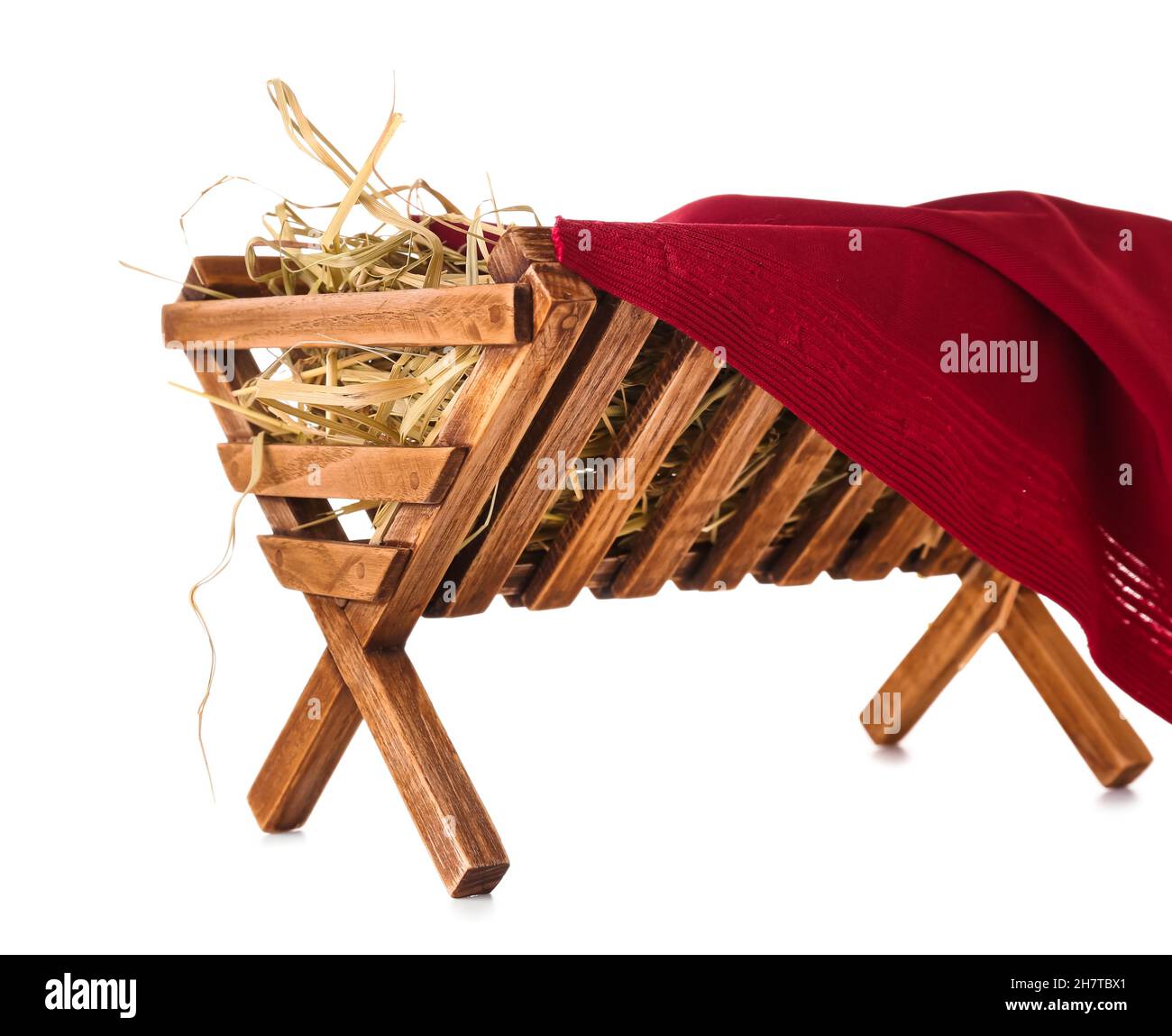 Wooden manger with hay on white background Stock Photo - Alamy