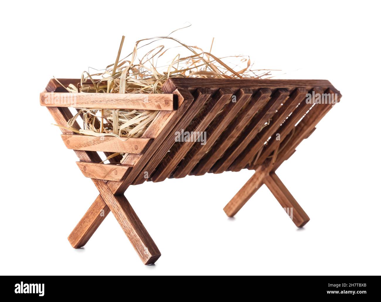Wooden manger with hay on white background Stock Photo - Alamy