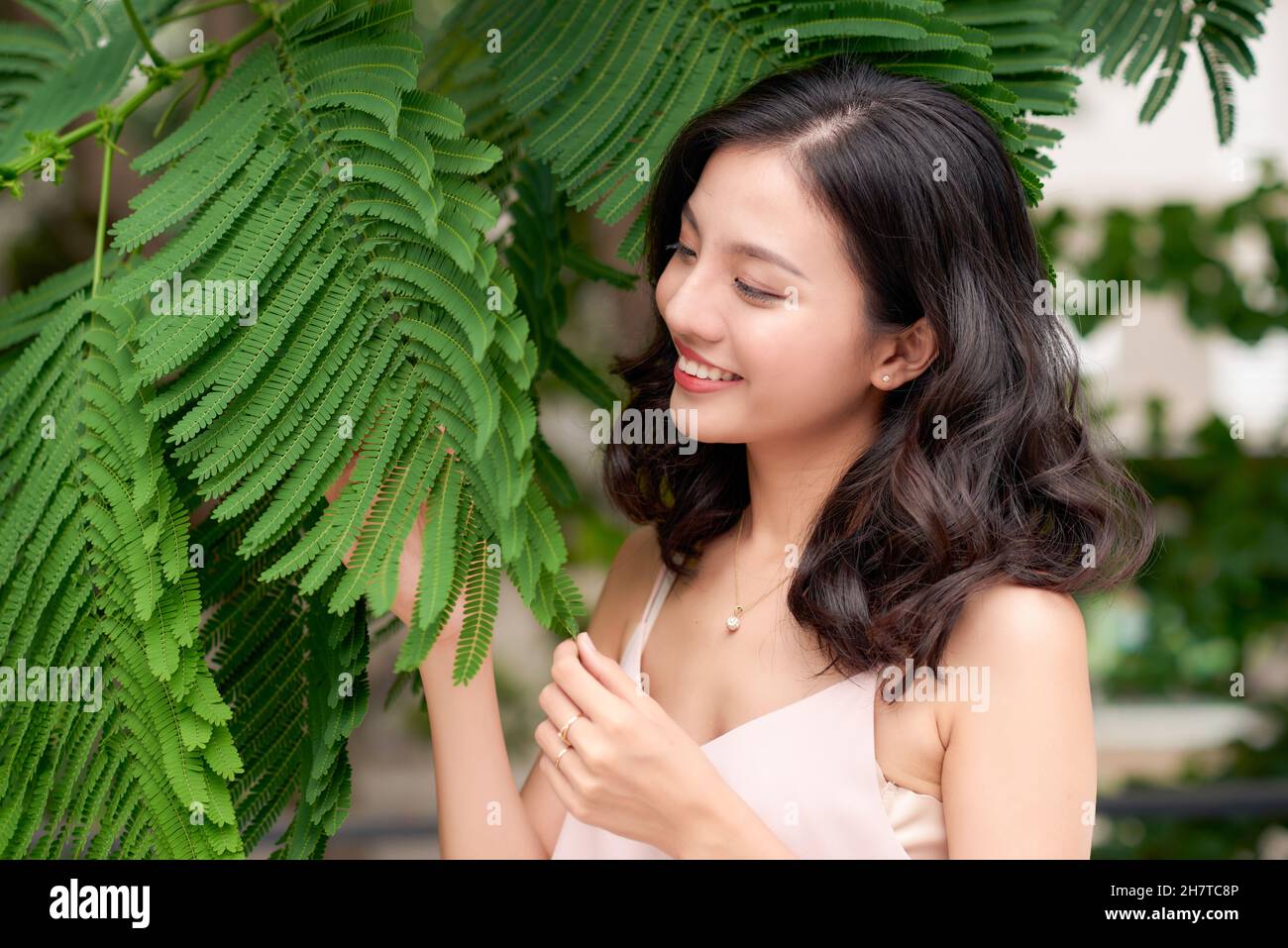 Woman around a beautiful garden Stock Photo - Alamy