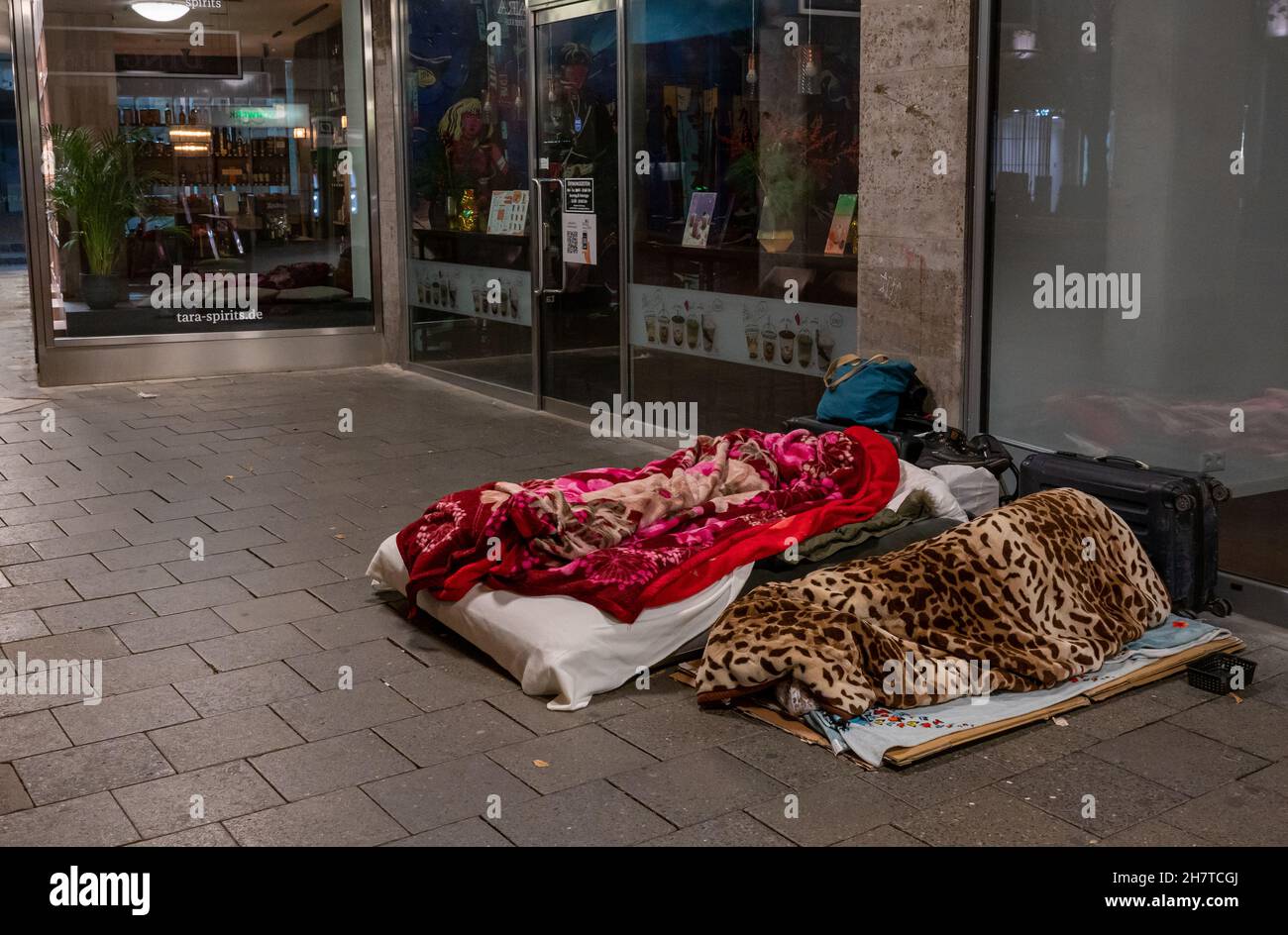 Two homeless people sleep in hi-res stock photography and images - Alamy