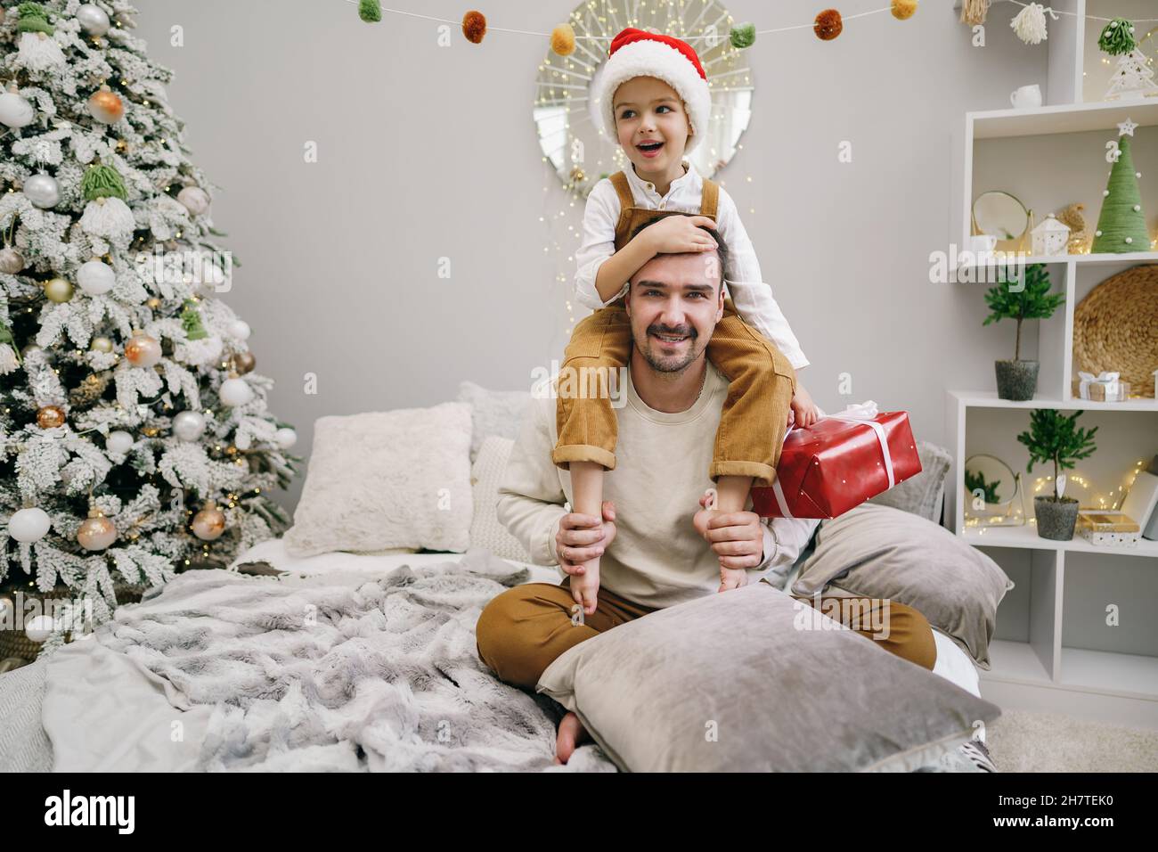 Young dad and his son celebrate christmas together Stock Photo - Alamy