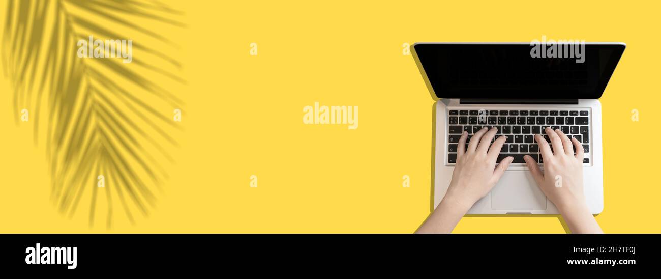 Laptop and hands banner background. Typing text on a computer keyboard ...