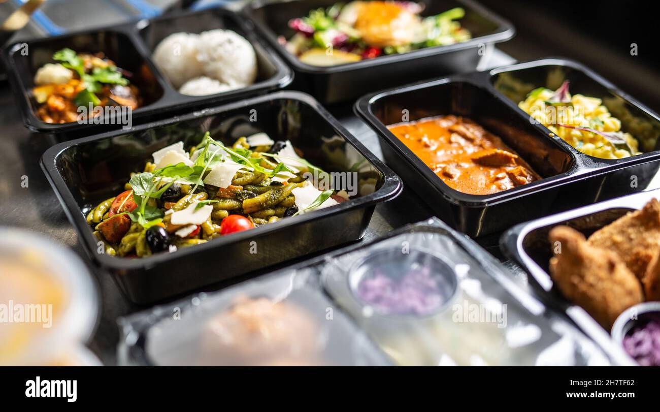 Open and closed plastic disposable takeaway containers with various ...