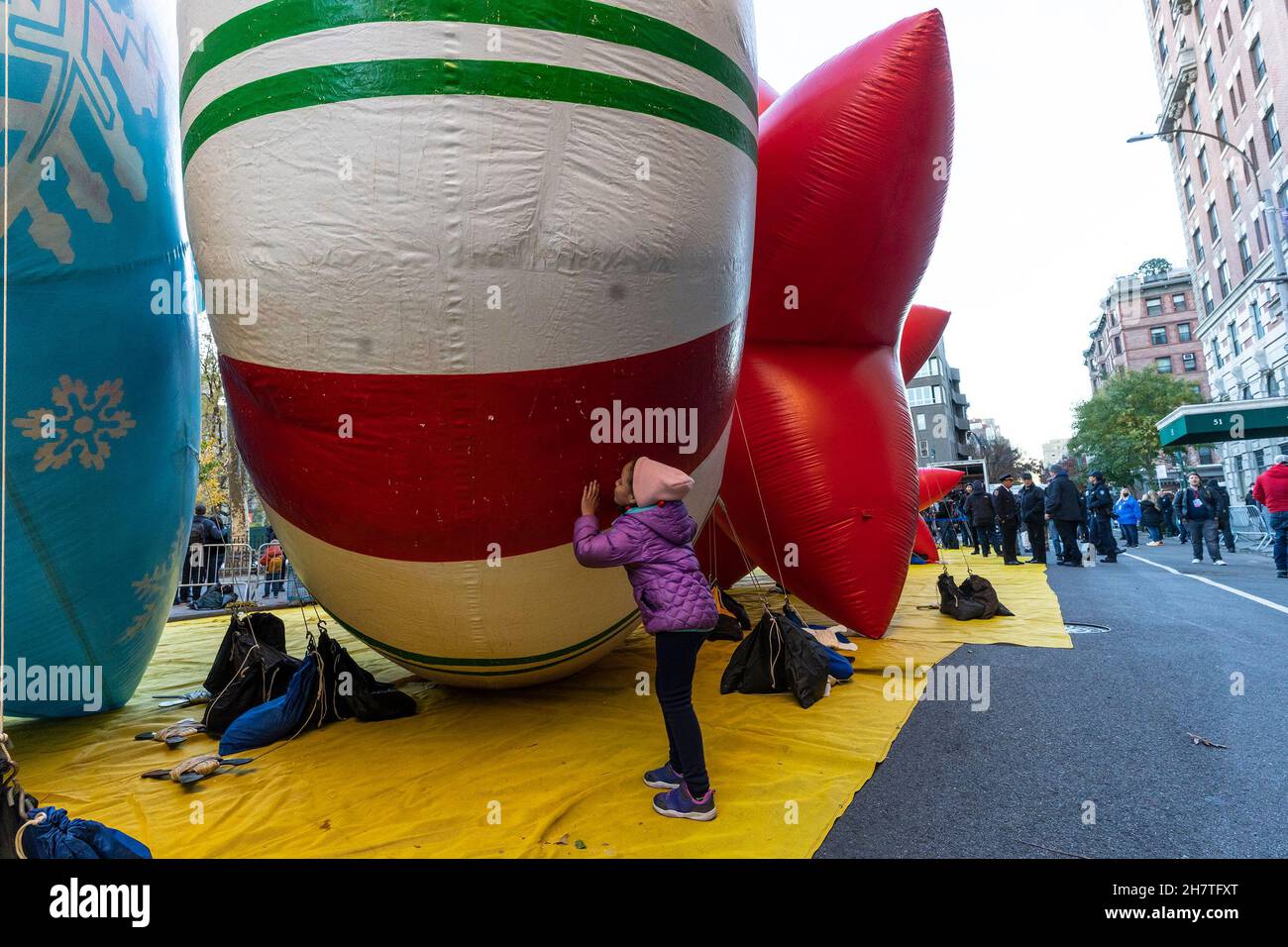 New York, United States. 24th Nov, 2021. Young girl pretends that she ...