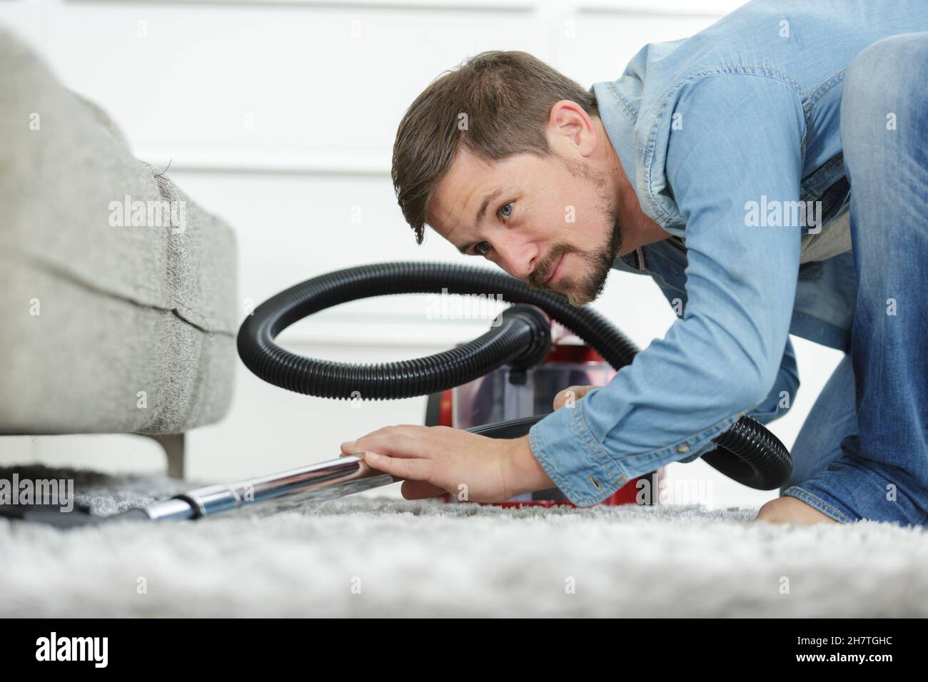 Man hoovering room hi-res stock photography and images - Alamy