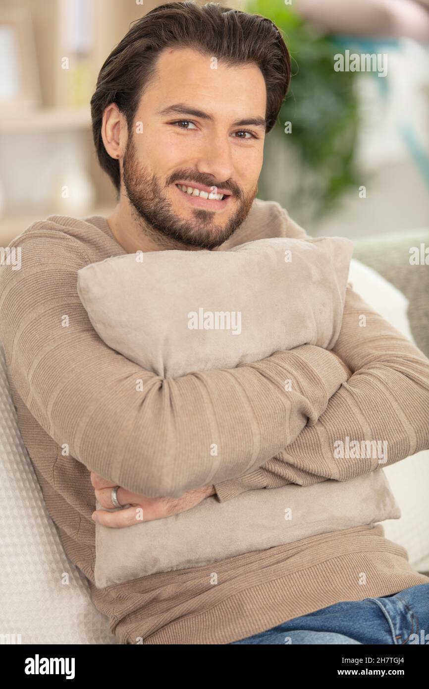 casual man resting sitting on a couch Stock Photo - Alamy