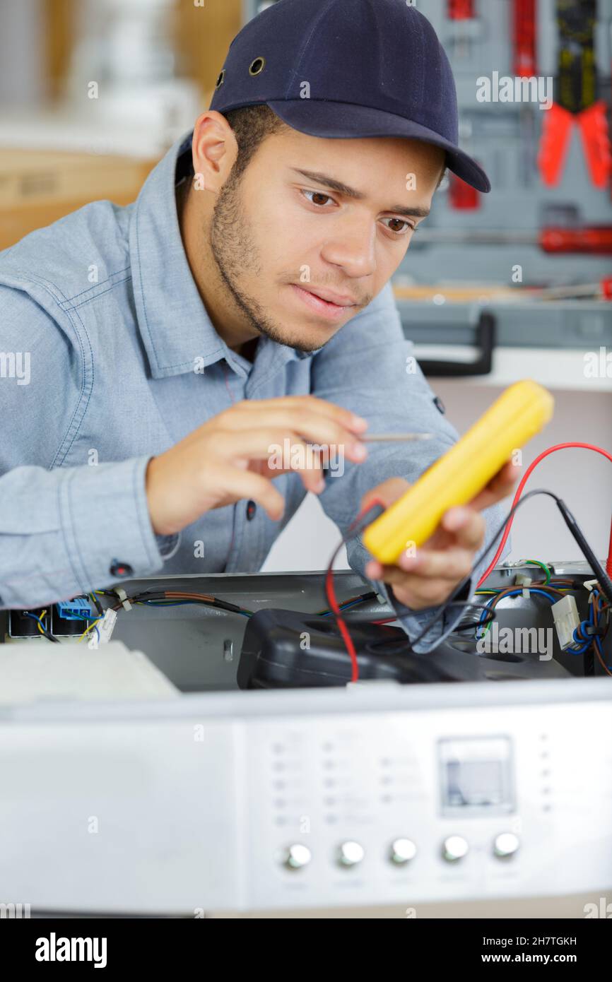 male worker checking a voltage problem Stock Photo - Alamy