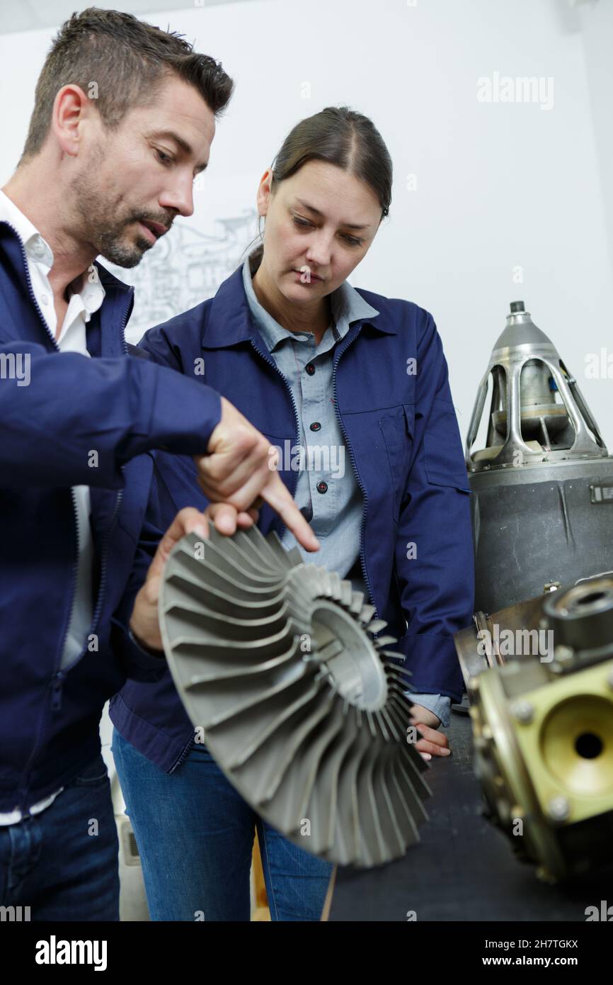 aircraft mechanic supervisor pointing at part Stock Photo - Alamy