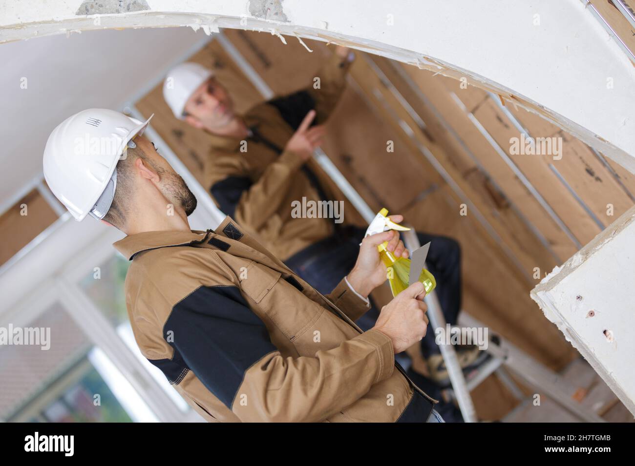Two builder hi-res stock photography and images - Alamy
