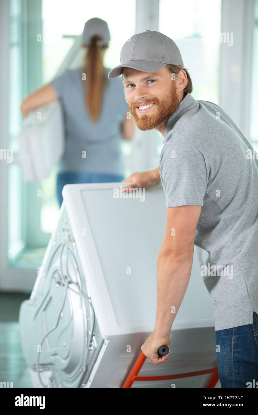 Carrying washing machine hi-res stock photography and images - Alamy