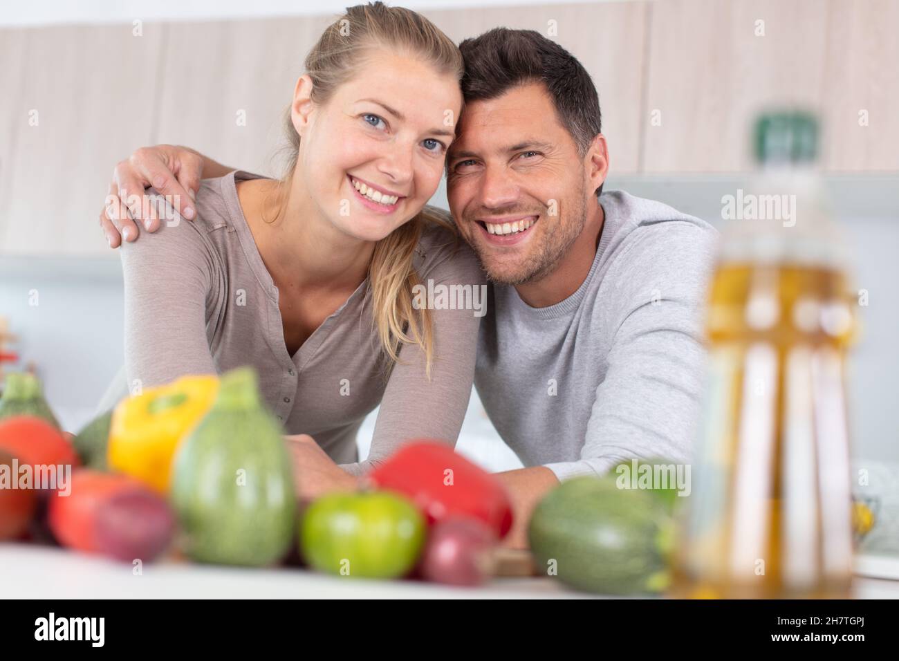 couple in love hugging in the kitchen Stock Photo - Alamy