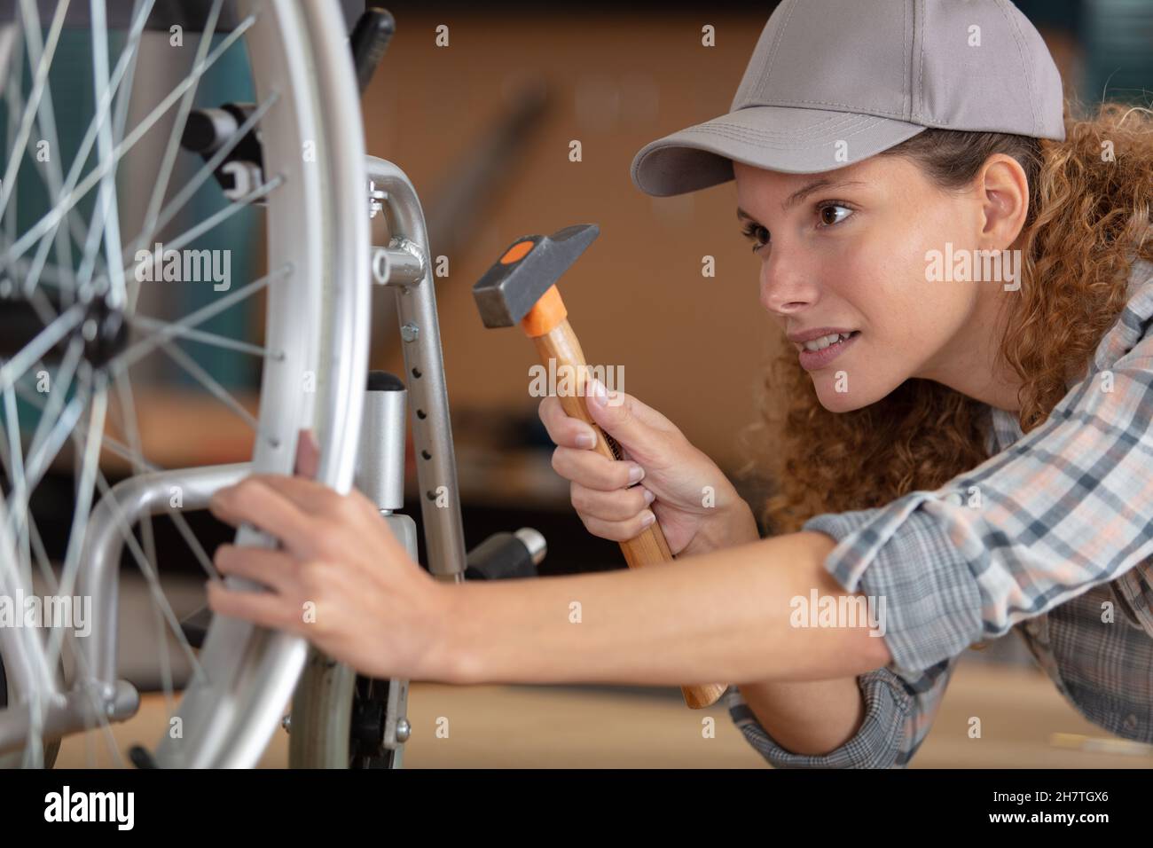 female mechanic maintaining a wheelchair Stock Photo - Alamy