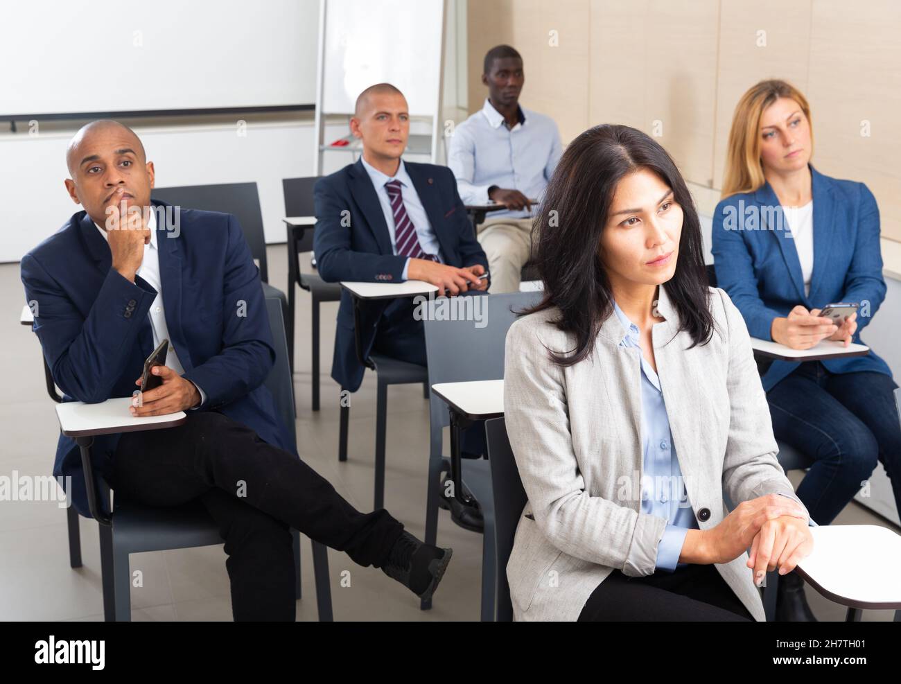 Focused people of during business seminar in lecture hall Stock Photo ...