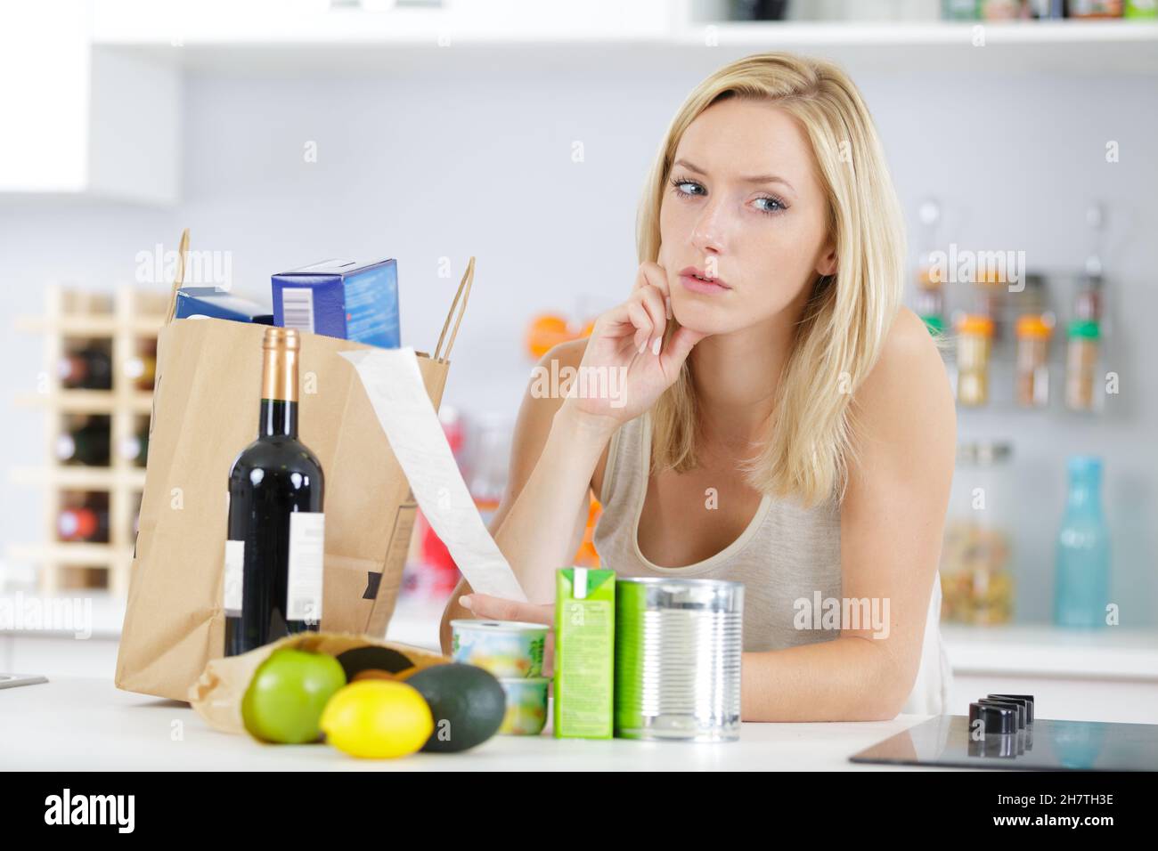 a woman writing shopping list Stock Photo - Alamy