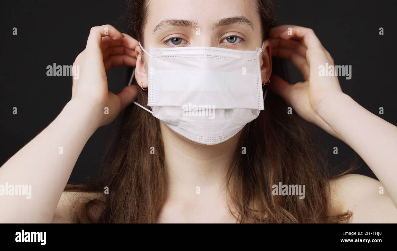 Woman dressing mask hi-res stock photography and images - Alamy