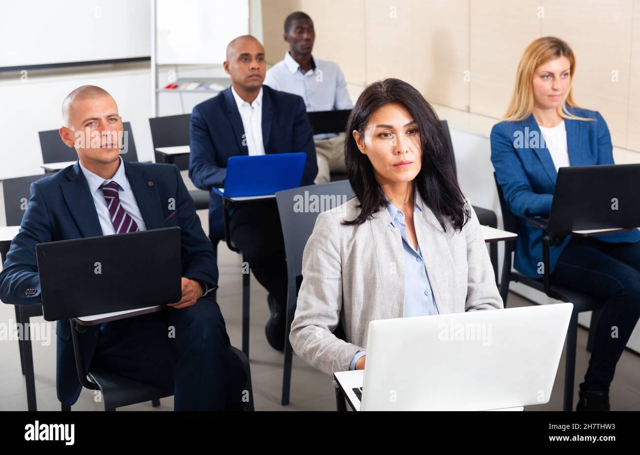 Group of people working with laptops during business training Stock ...
