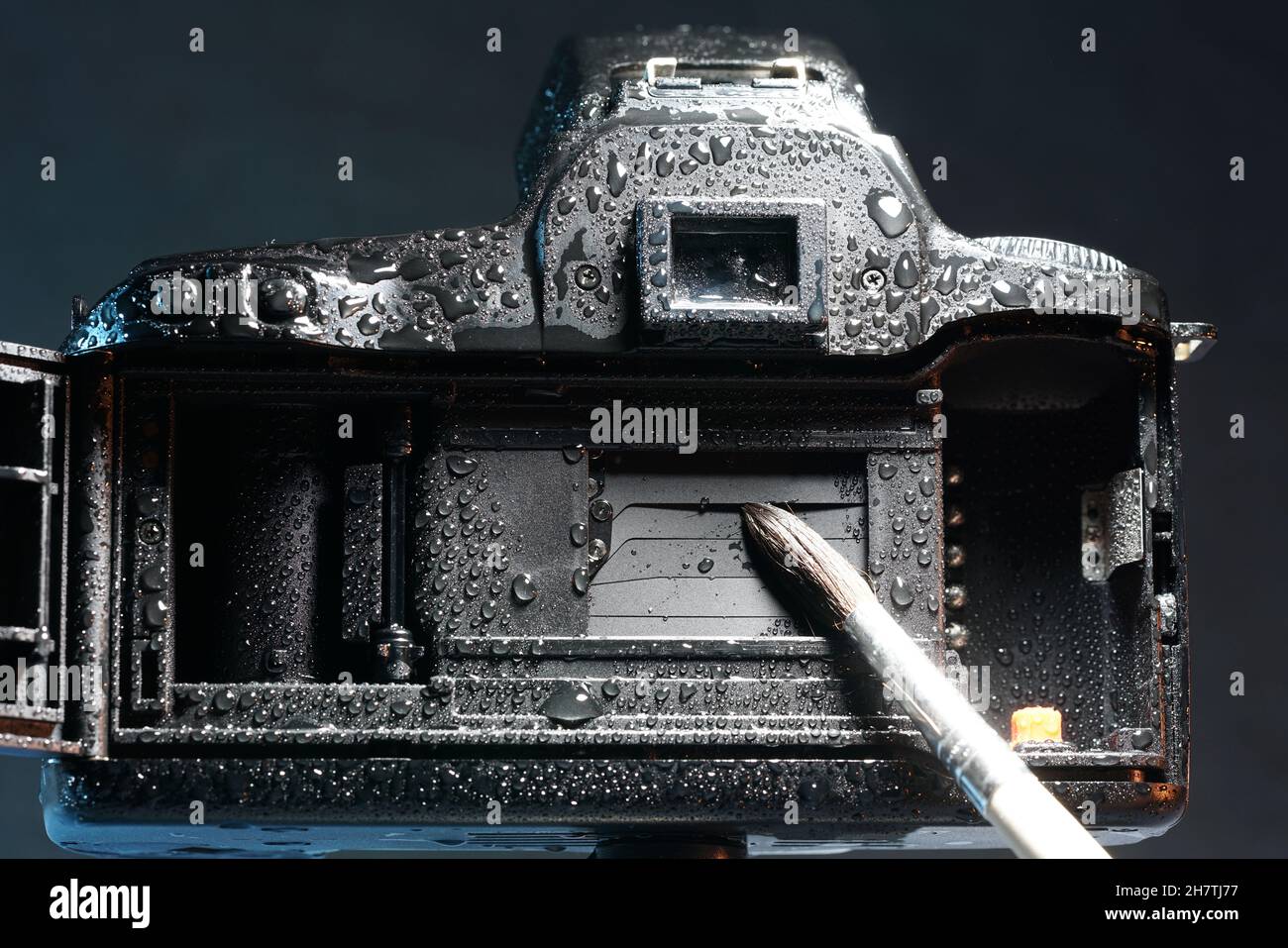Close-up shot of a broken and wet film camera Stock Photo - Alamy