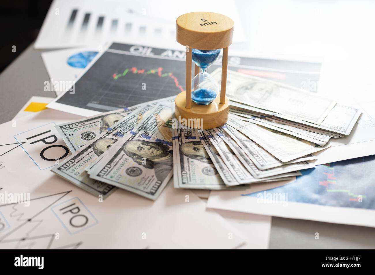 Business Charts with Dollar Money, hourglass Stock Photo - Alamy
