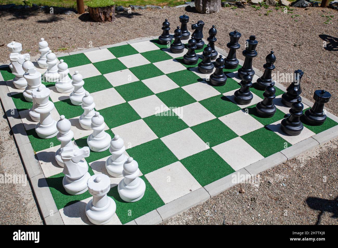 Giant outdoor chess set in park Stock Photo - Alamy
