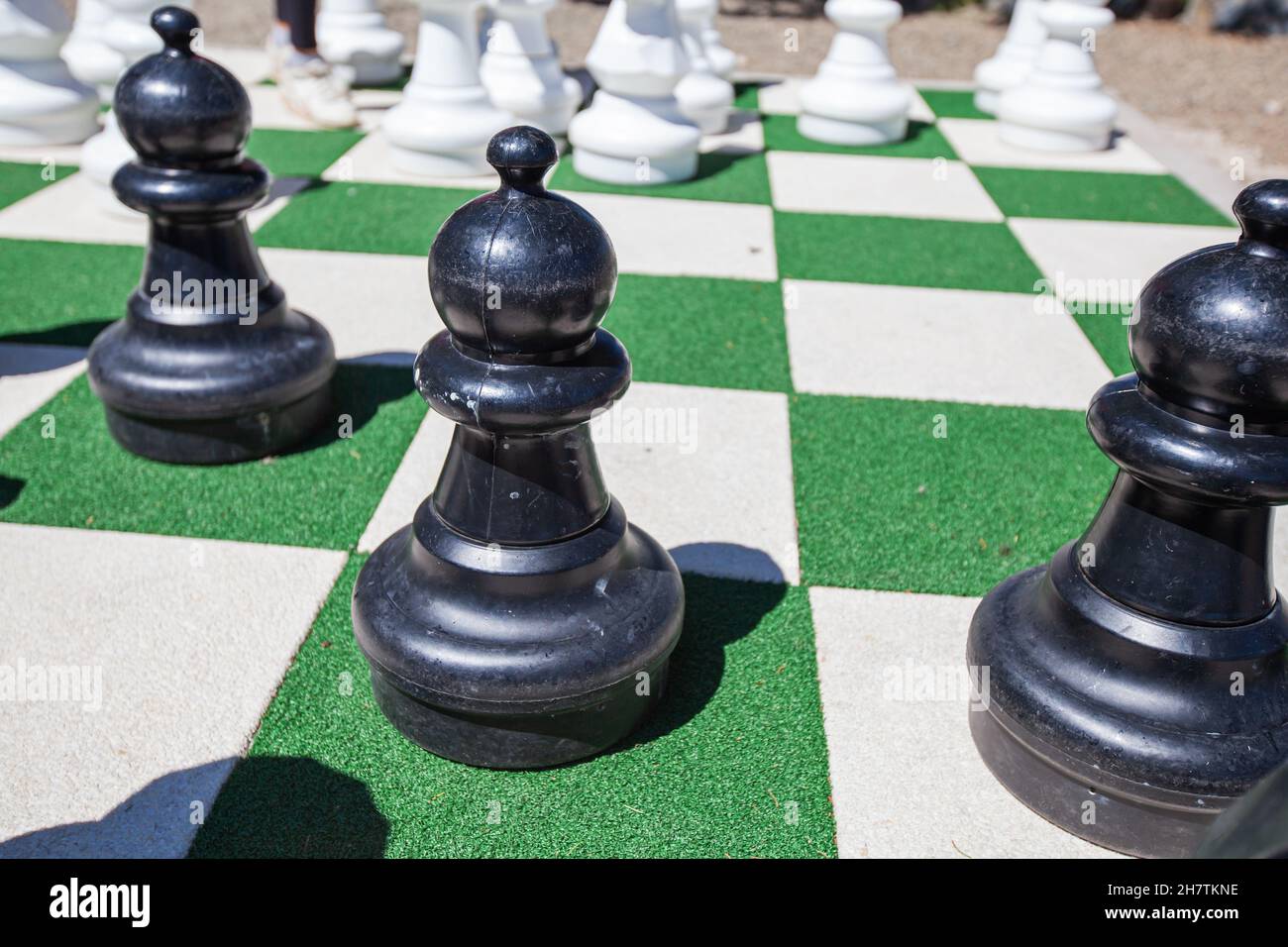 Giant outdoor chess set in park Stock Photo - Alamy