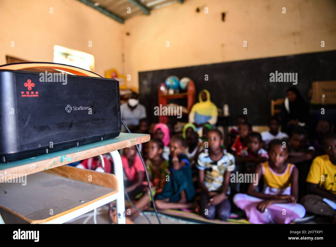 Dakar, Senegal. 22nd Nov, 2021. Students watch satellite television via ...