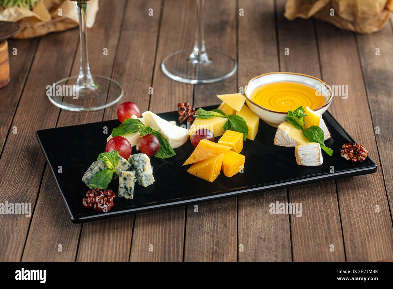 Assorted cheese wine appetizer platter Stock Photo - Alamy