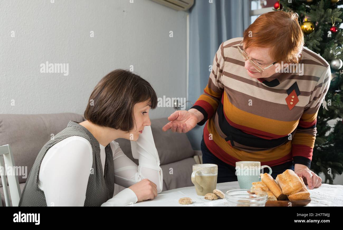 Senior woman calming sad hi-res stock photography and images - Alamy