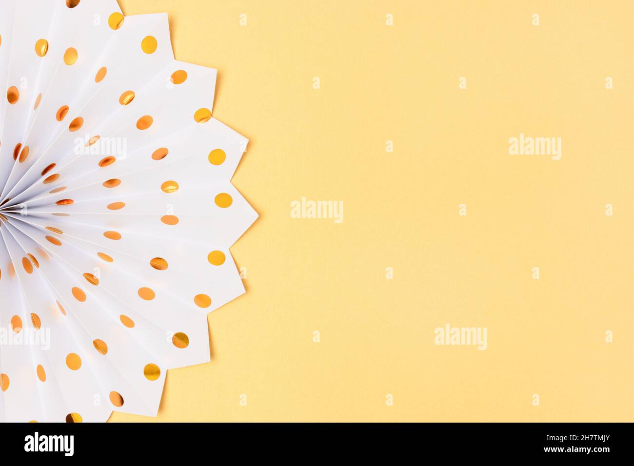 One golden paper fan. Monochrome festive composition Stock Photo - Alamy