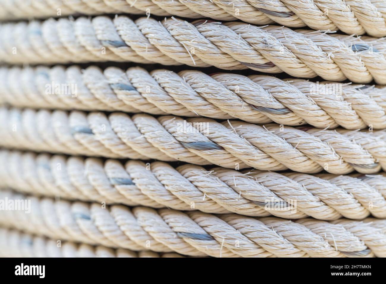 Nautical ropes tied around the wood background Stock Photo - Alamy
