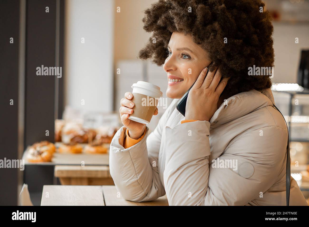 People Drinking Coffee In A Cafe